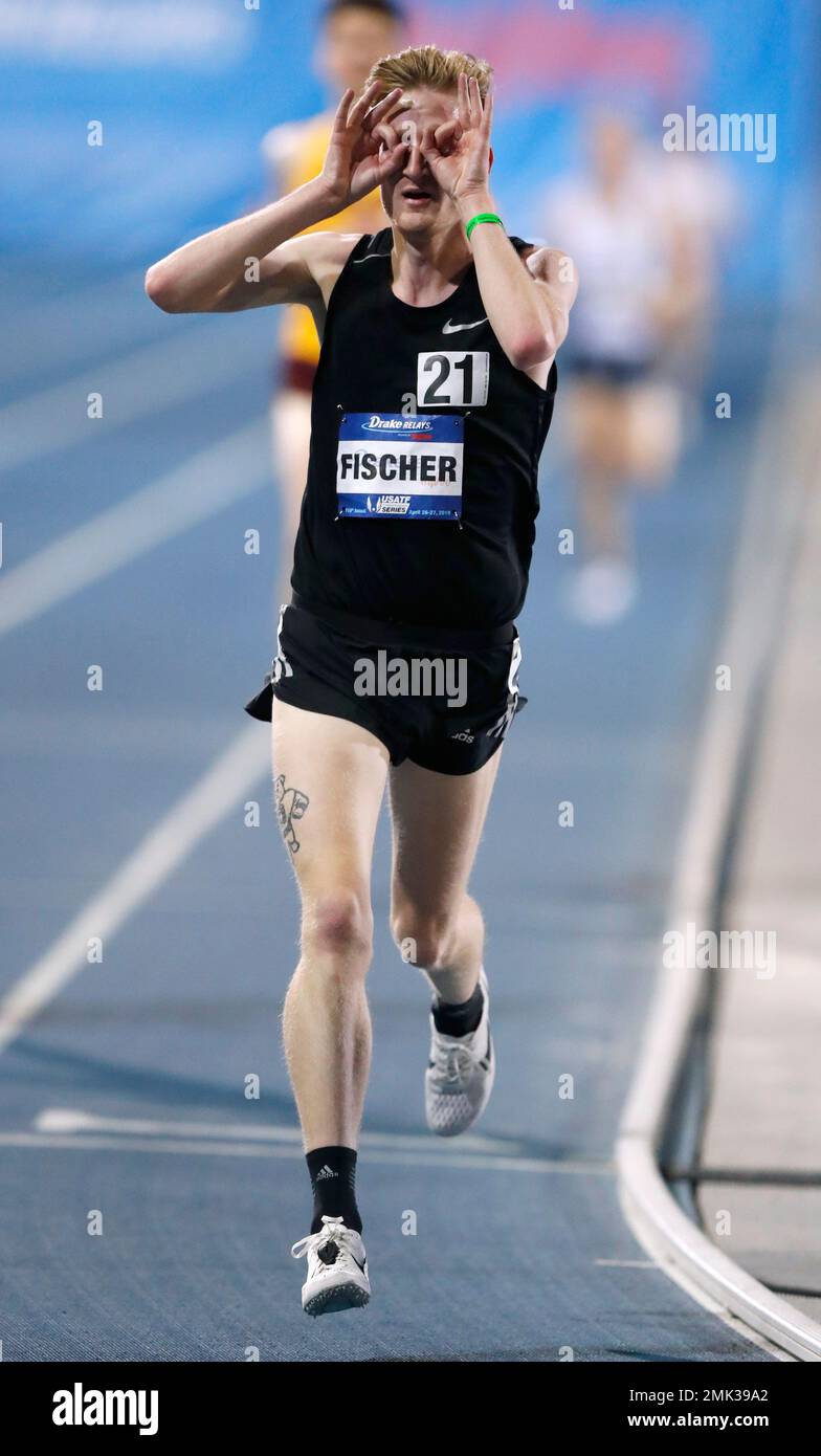 Reed Fischer celebrates as he wins the men's 5,000-meter run at the ...
