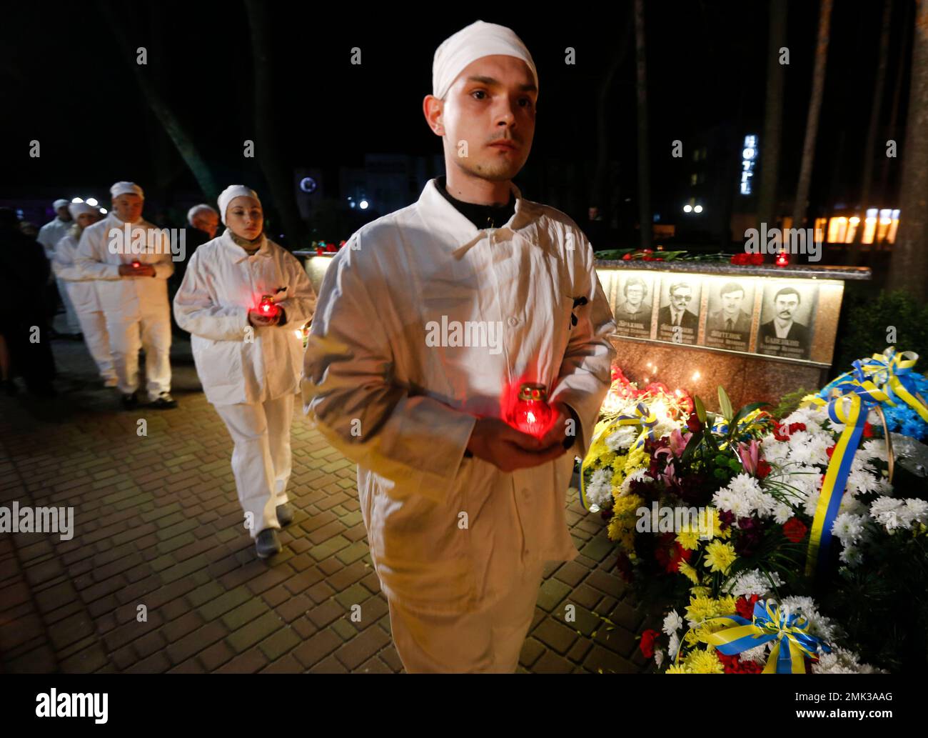 The Chernobyl nuclear plant workers in uniform attend a ceremony to ...