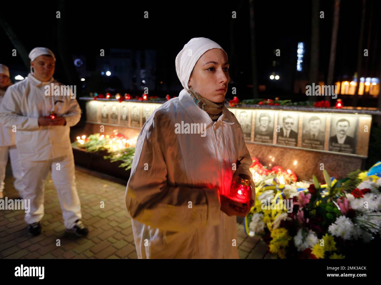 The Chernobyl nuclear plant workers in uniform attend a ceremony to ...