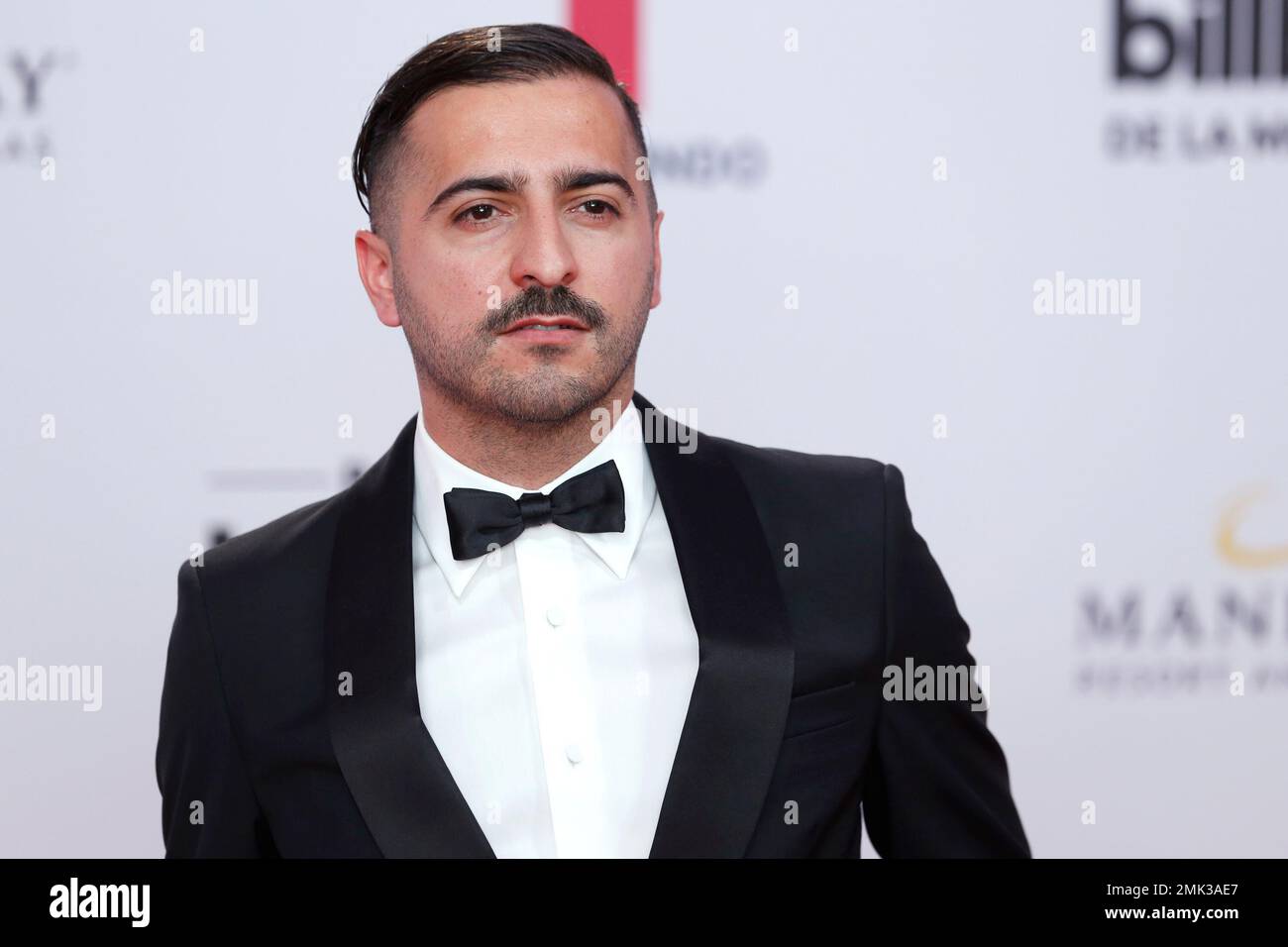 El Guincho arrives at the Billboard Latin Music Awards on Thursday ...