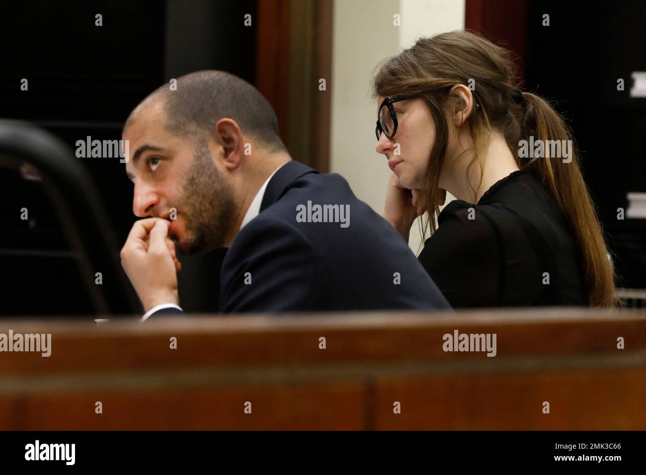 Anna Sorokin and her lawyer Todd Spodek listen to testimony read back ...