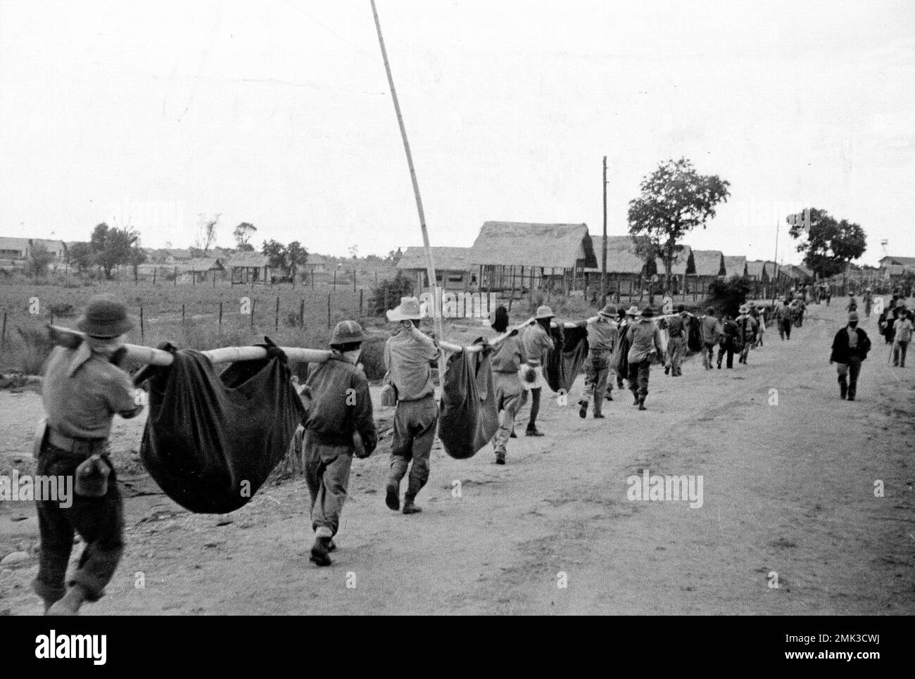 Nearing the end of a grim journey, a thinning file of prisoners ...