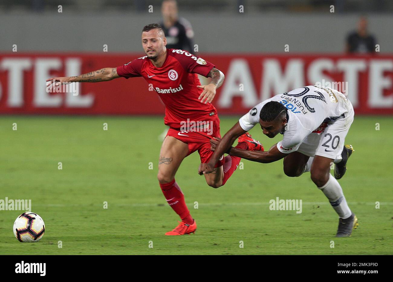 Aldair Fuentes of Peru's Alianza Lima, right, pulls on the uniform of ...