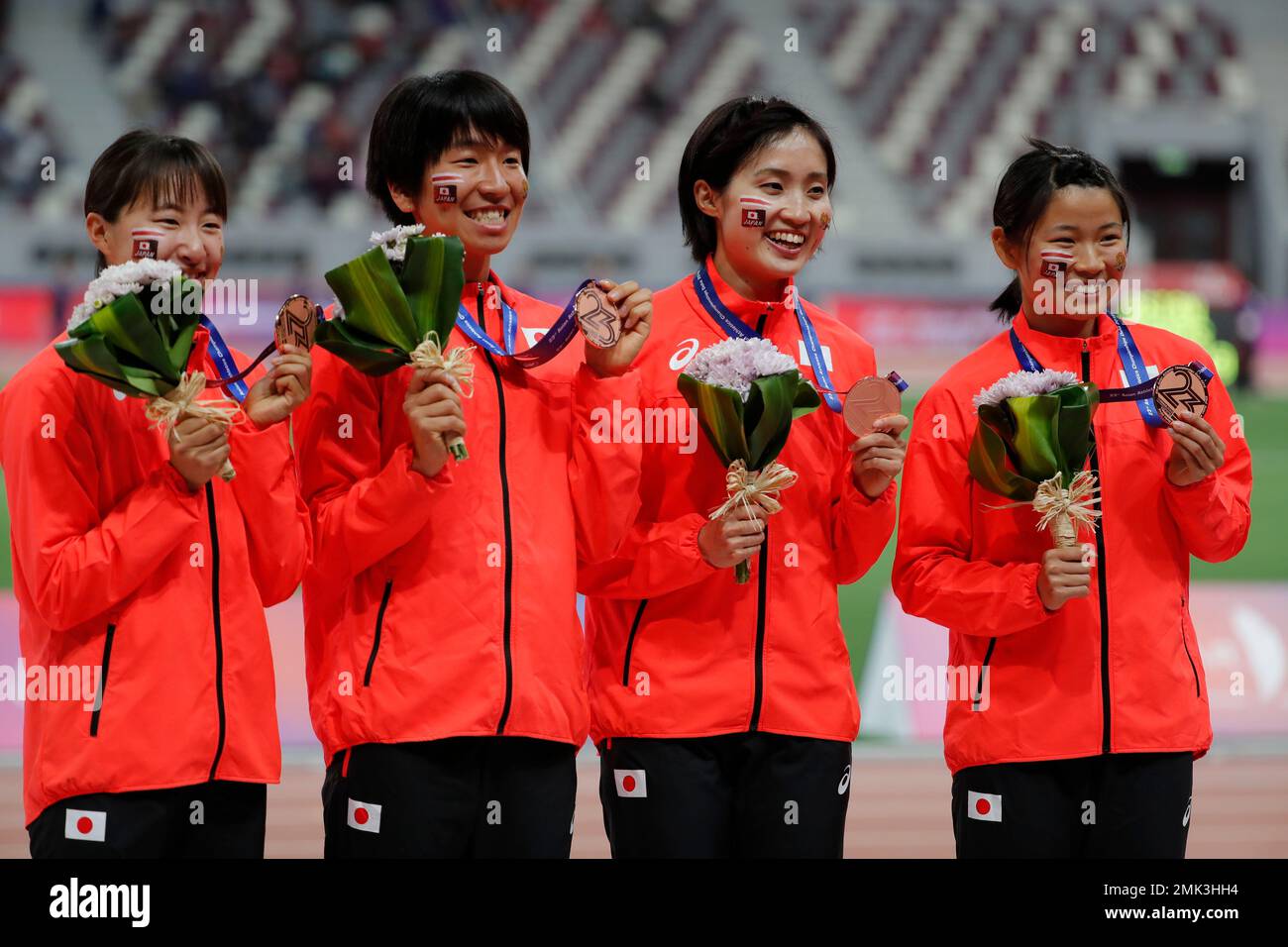 Japanese athletes celebrate their bronze medal for the 4x400 relay at ...