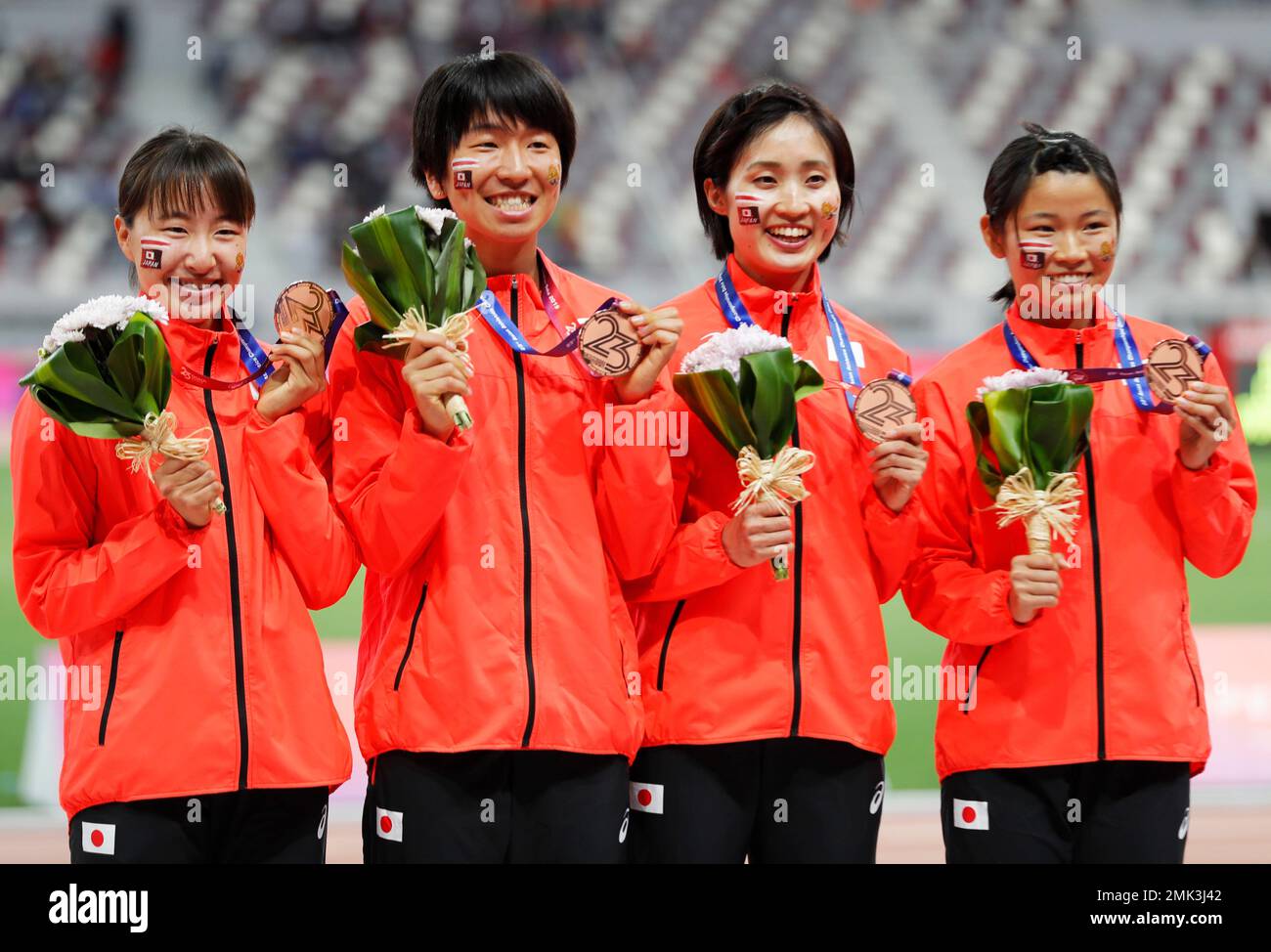 Japanese athletes celebrate their bronze medal for the 4x400 relay at ...