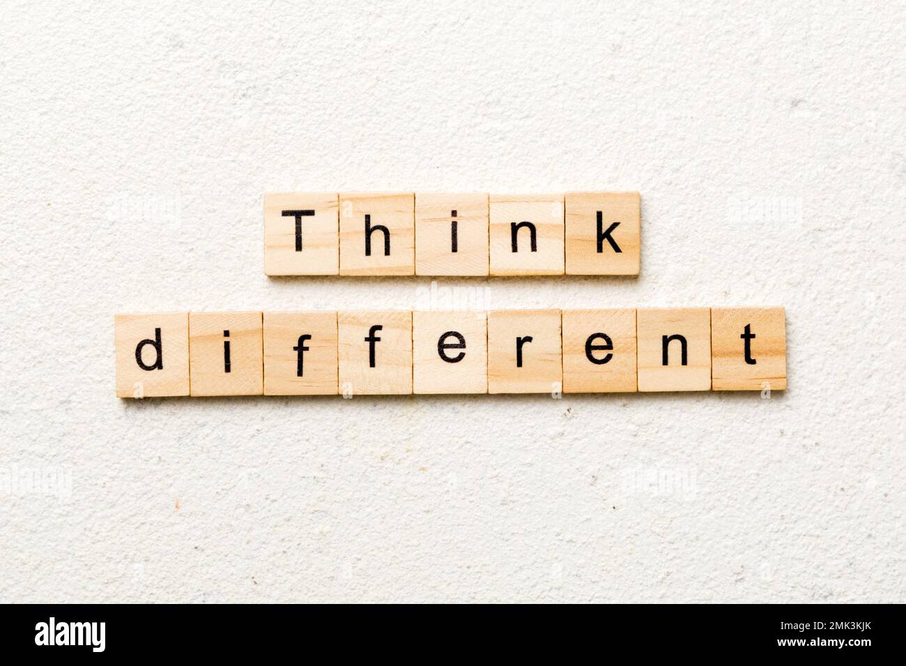think different word written on wood block. think different text on ...