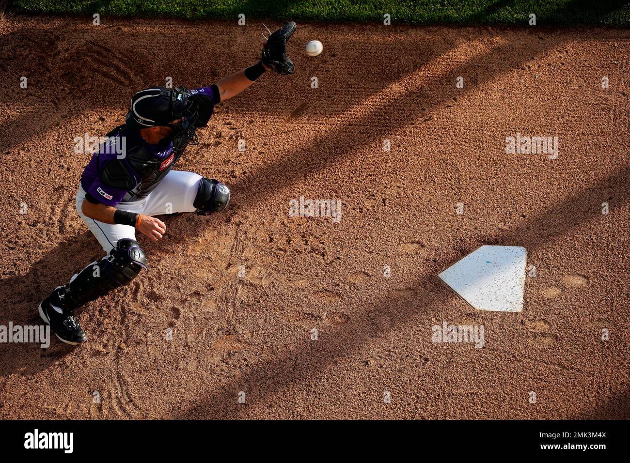 Colorado Rockies catcher Drew Butera warms up in the bull pen before ...