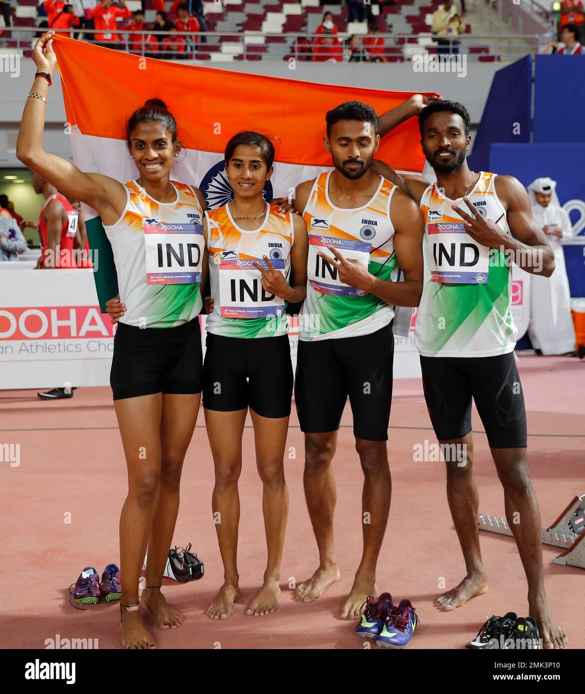 Indian athletes celebrate after competing in the 4x400 mixed relay ...