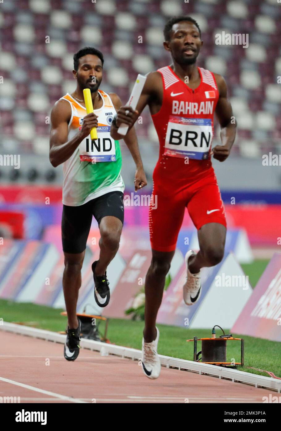 Athletes from Bahrain, right, and India compete in the 4x400 mixed ...