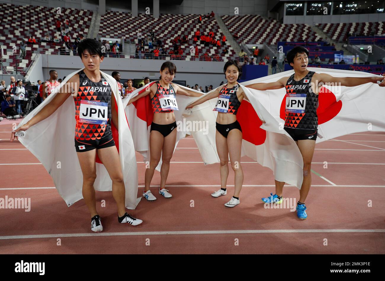 Japanese athletes celebrate after the 4x400 mixed relay final at the ...