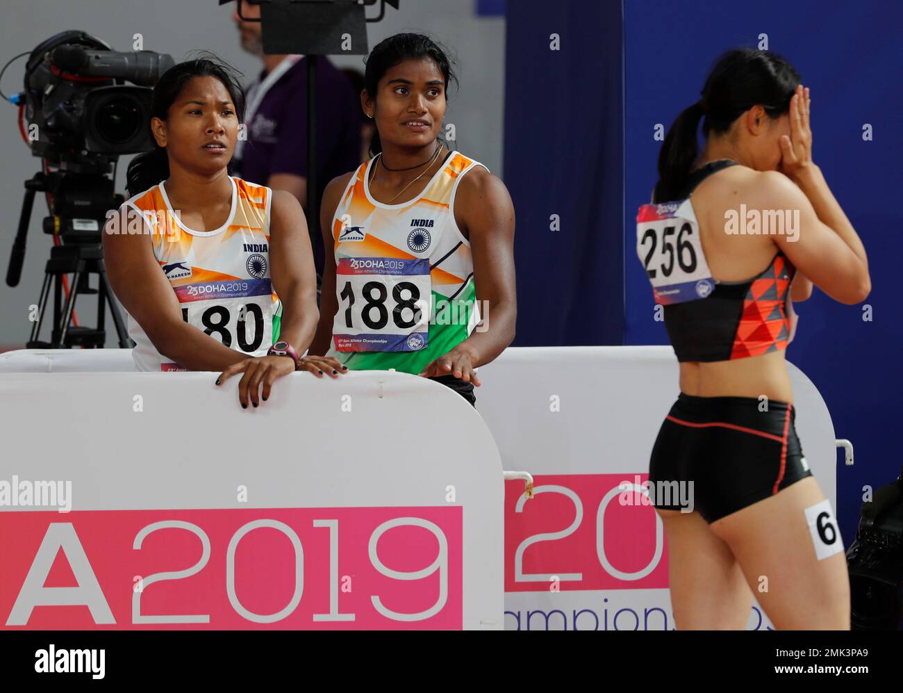 Japan's Yuki Yamasaki, right, reacts as India's Purina Hembram, center, and Swapna Barman look ...