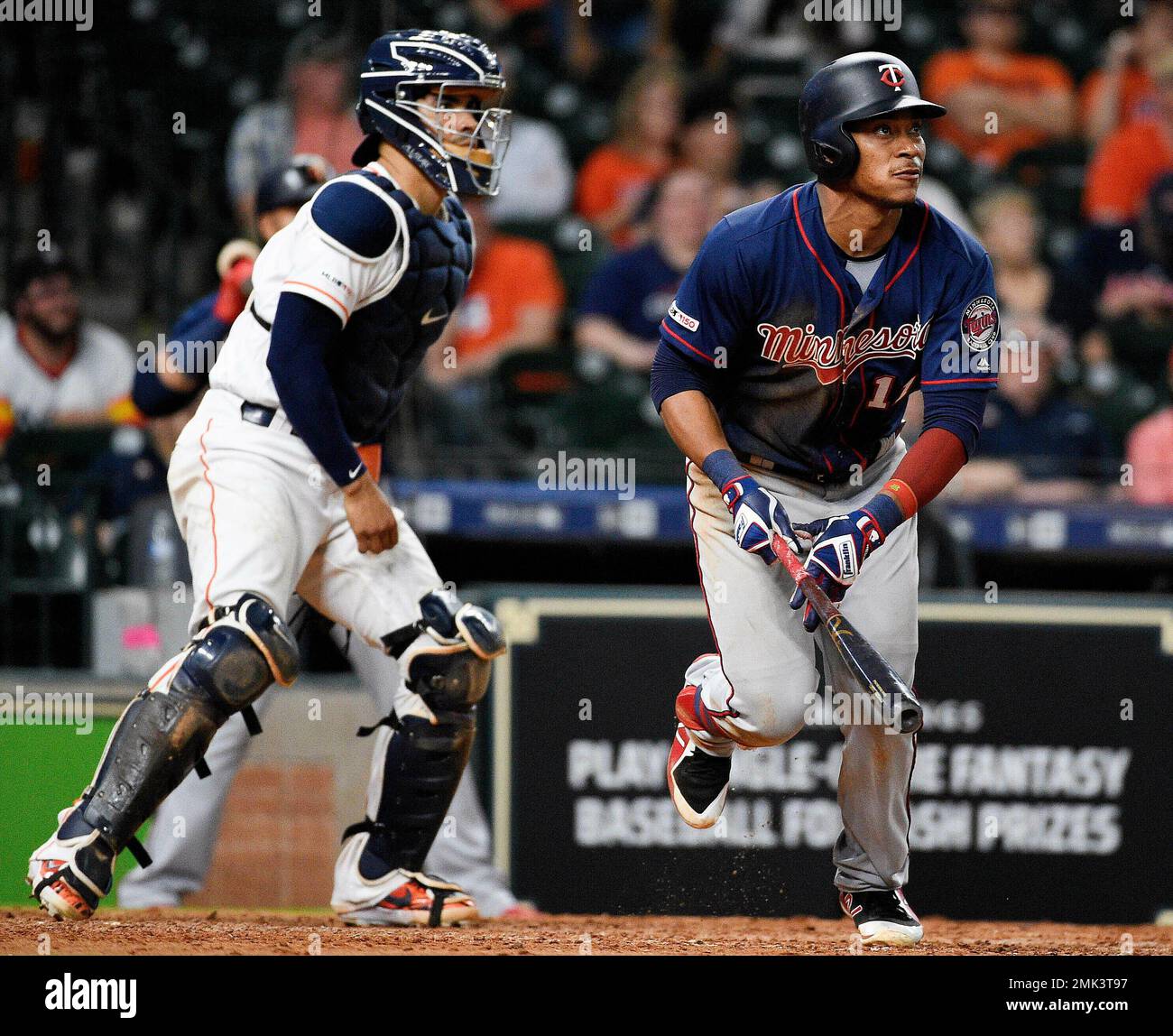 Minnesota Twins' Jorge Polanco, right, watches his two-run home run off ...