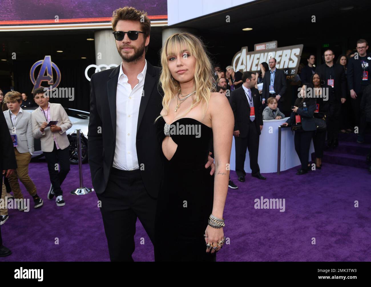 Liam Hemsworth, left, and Miley Cyrus arrive at the premiere of ...