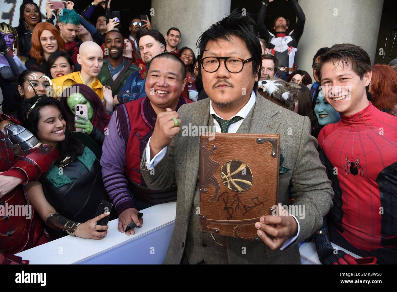 Benedict Wong poses with a fan as he arrives at the premiere of ...