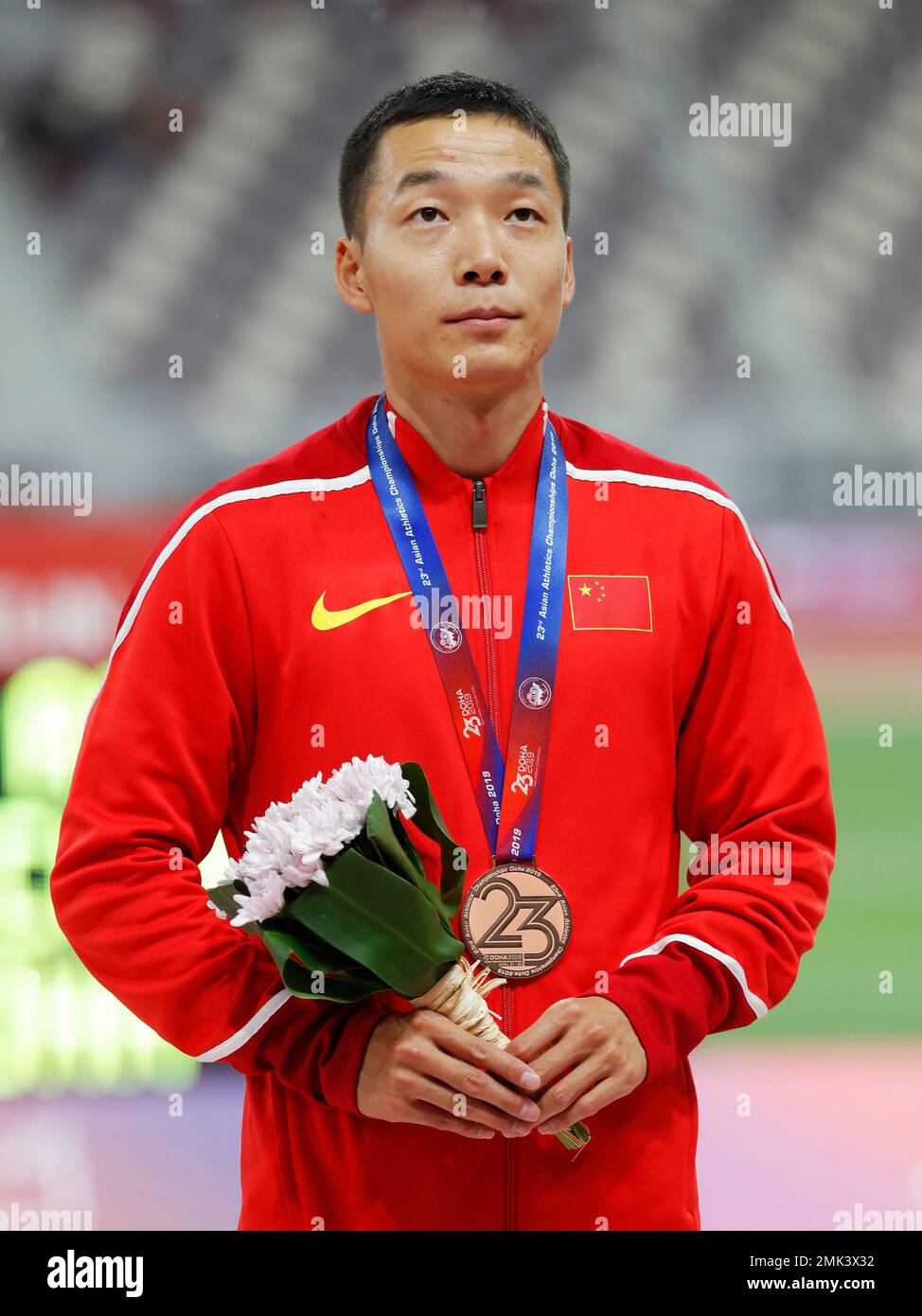 China's Wu Zhiqiang stands during the medal ceremony after receiving his bronze medal for the ...