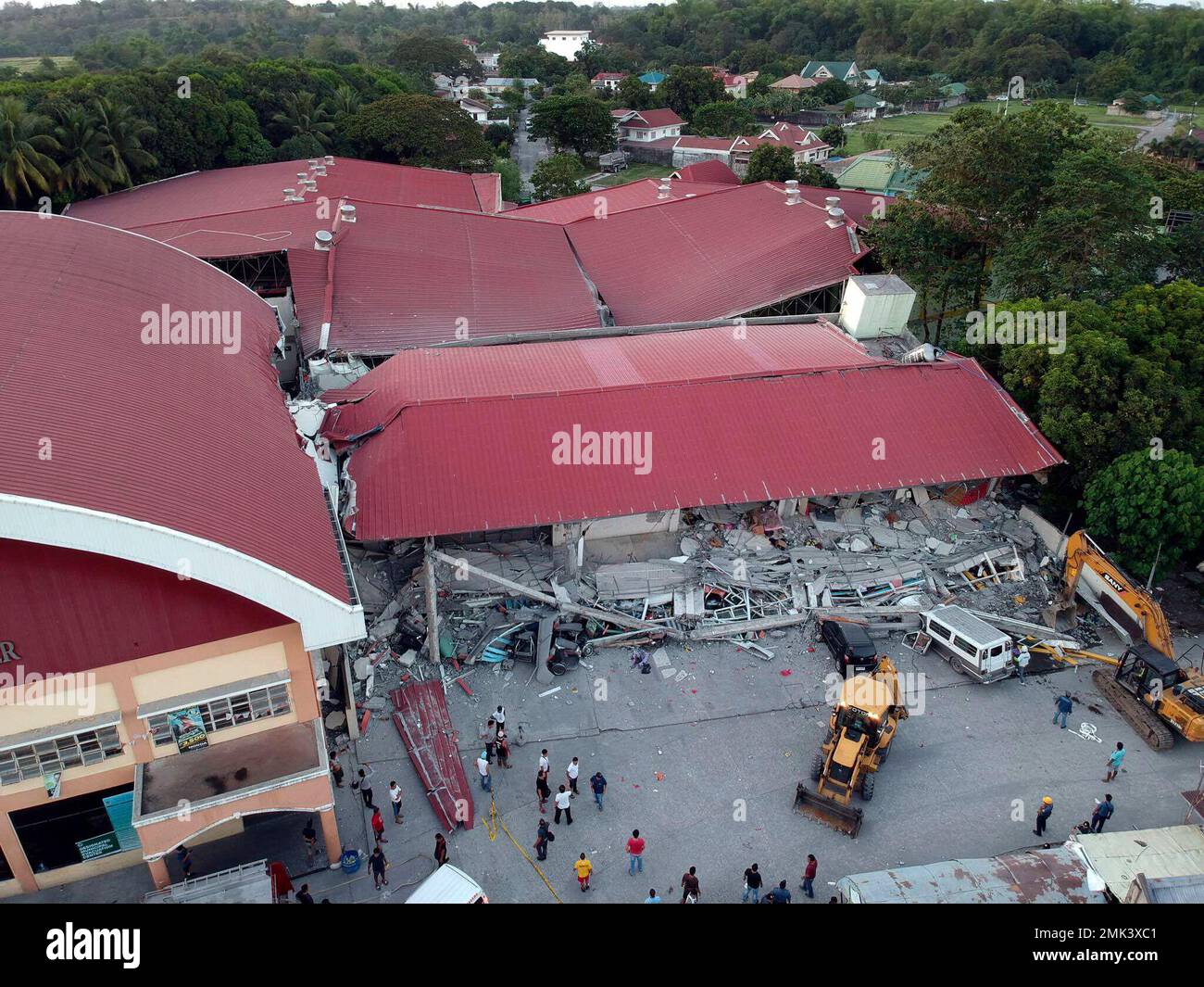 Workers continue rescue efforts for people still trapped inside a ...