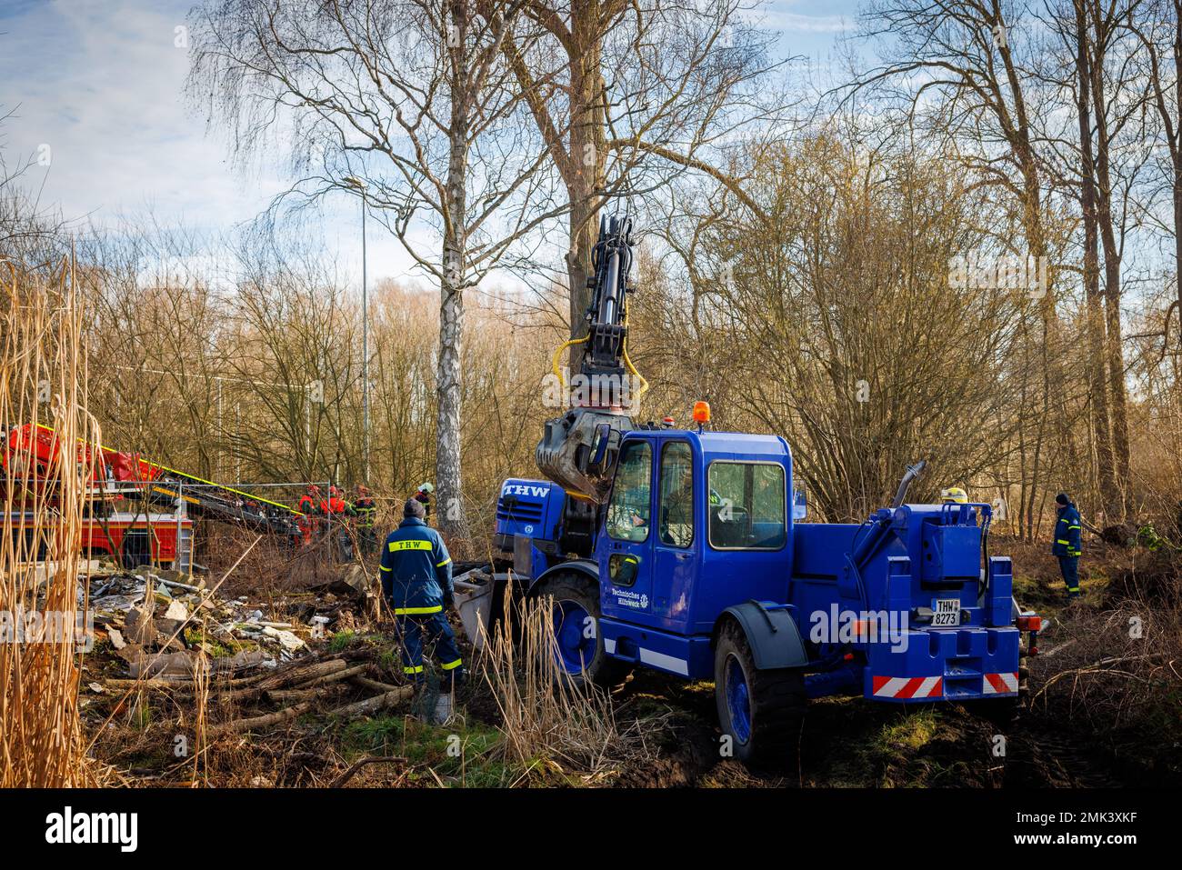 Members of THW remove construction debris with the help of a wheeled ...