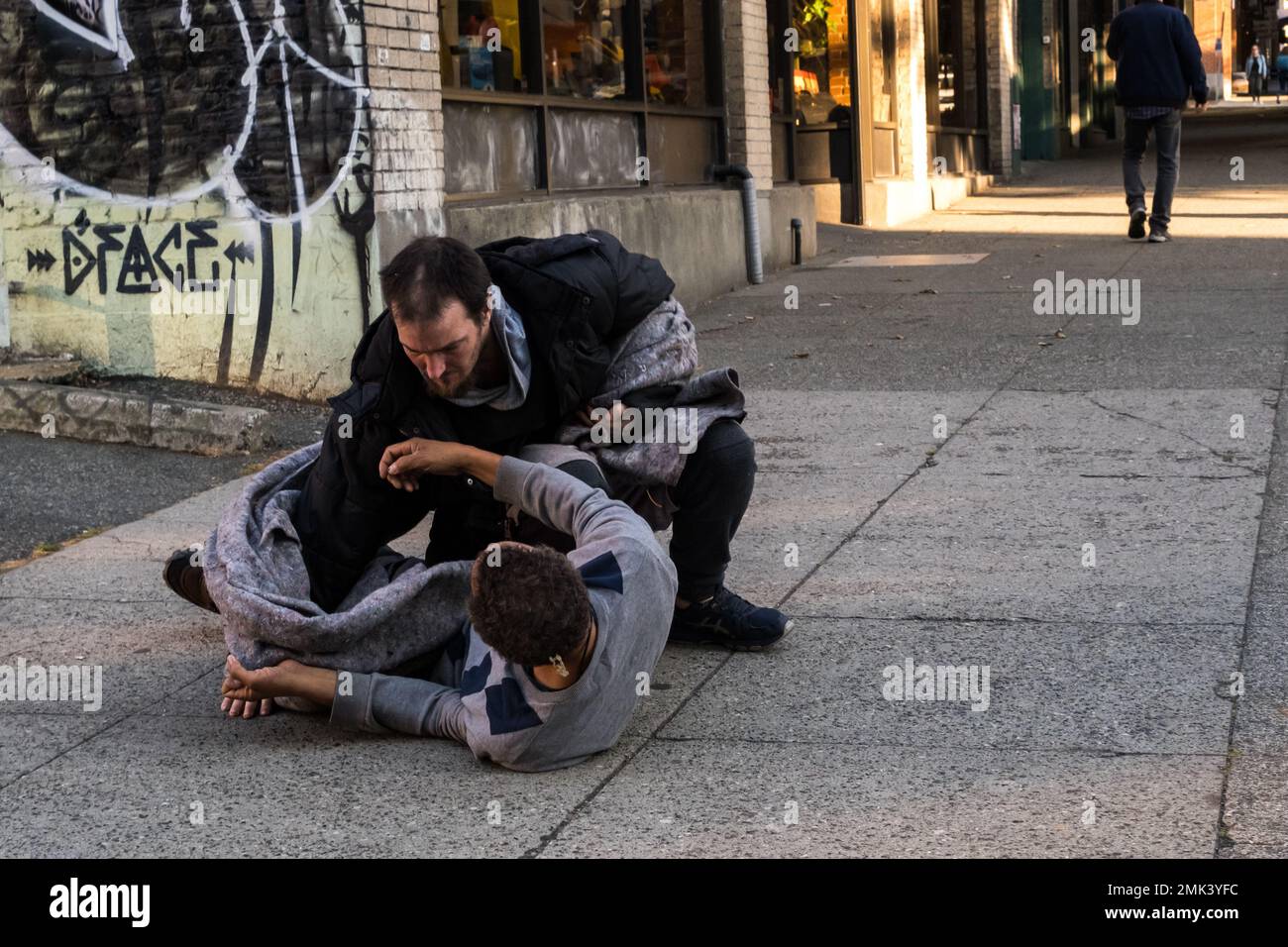 Helping someone get up hi-res stock photography and images - Alamy