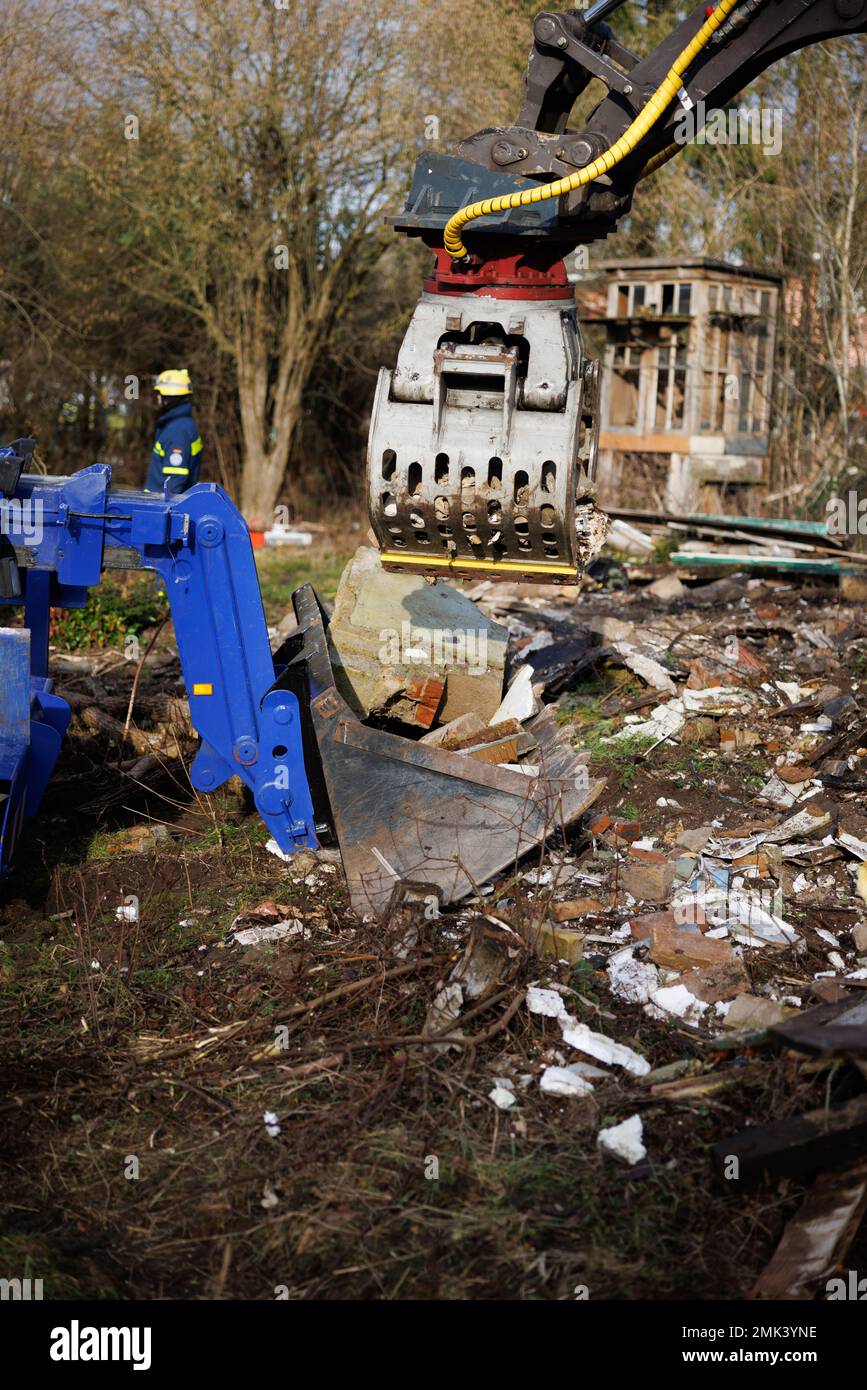 Members of THW remove construction debris with the help of a wheeled ...