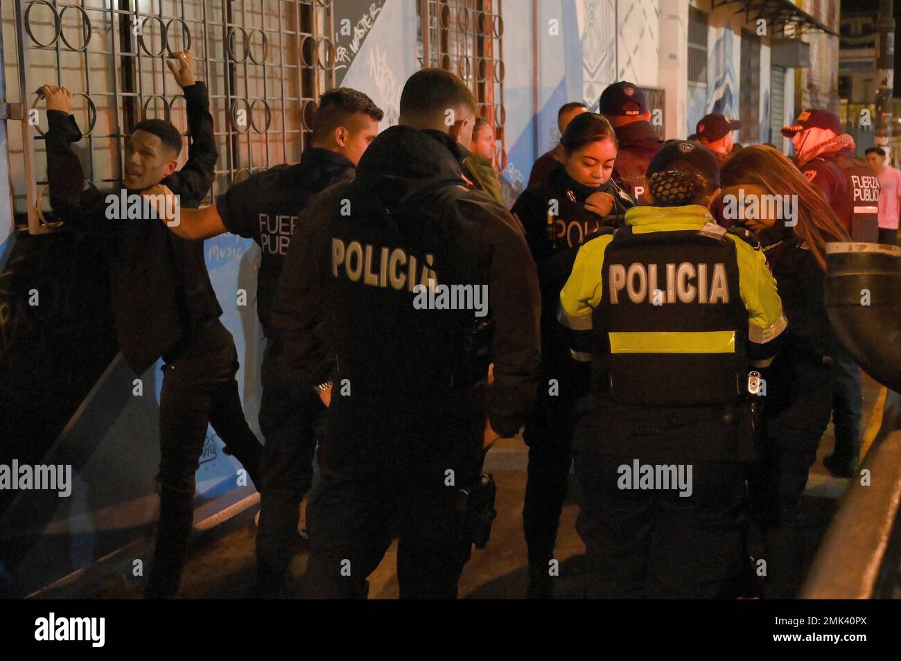 Police officer run a checkpoint set up in the nightclubs and bar zone ...