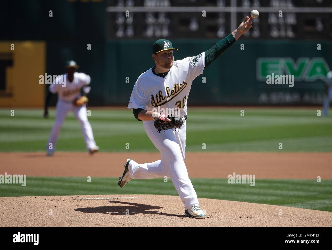 Oakland Athletics pitcher Brett Anderson throws against the Toronto ...
