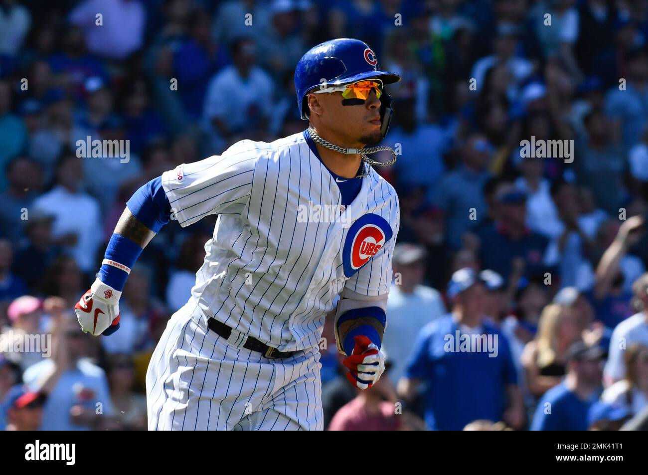 Chicago Cubs' Javier Baez (9) runs the bases after he hit an RBI triple ...