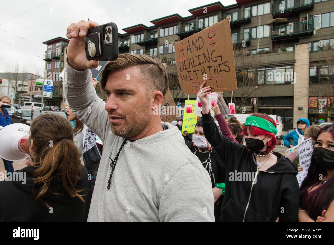 Seattle, USA. 8th Mar, 2022. A counter protestor with the PAAU group at ...