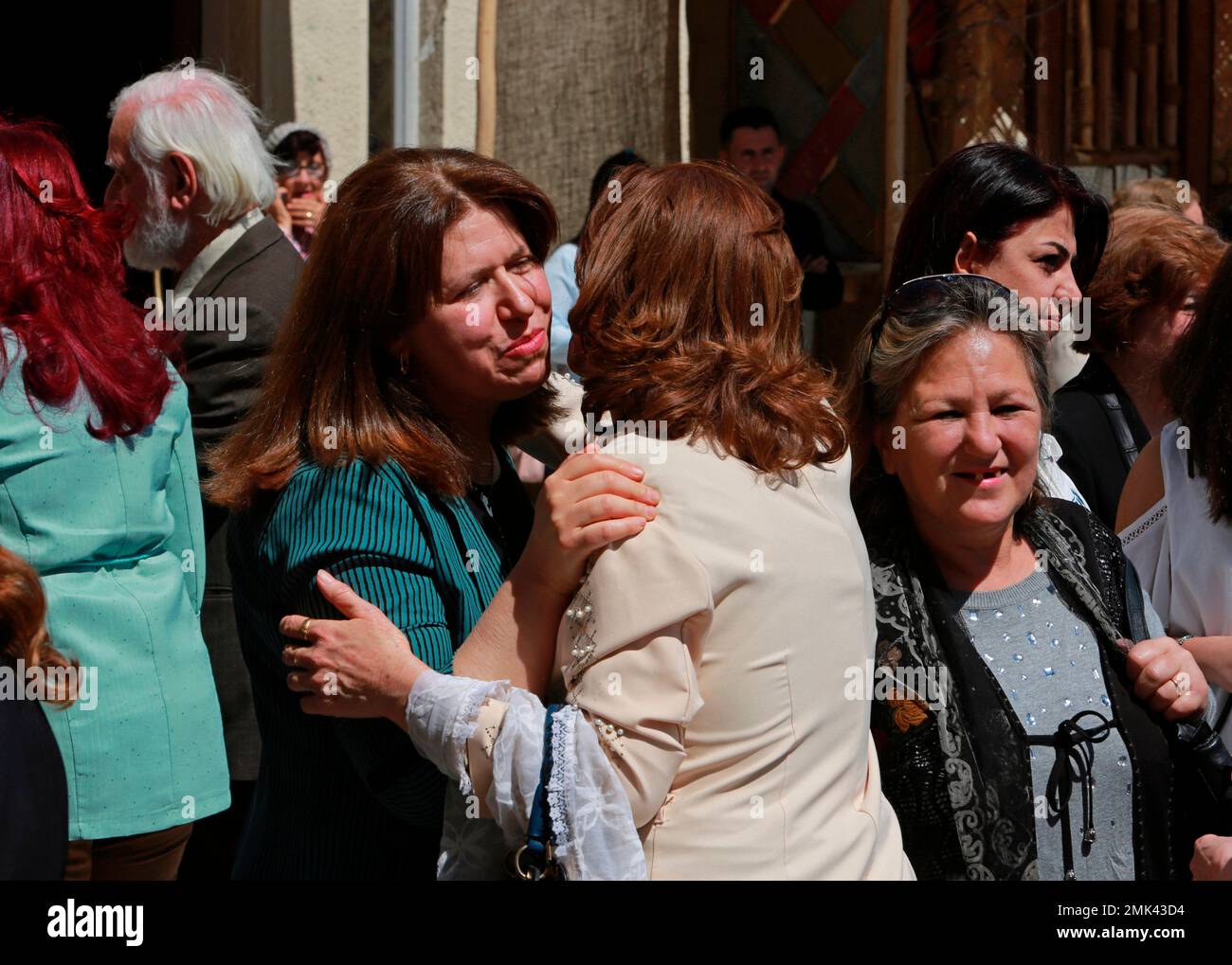 Iraqi Christians greet each other after Easter Mass at St. George ...