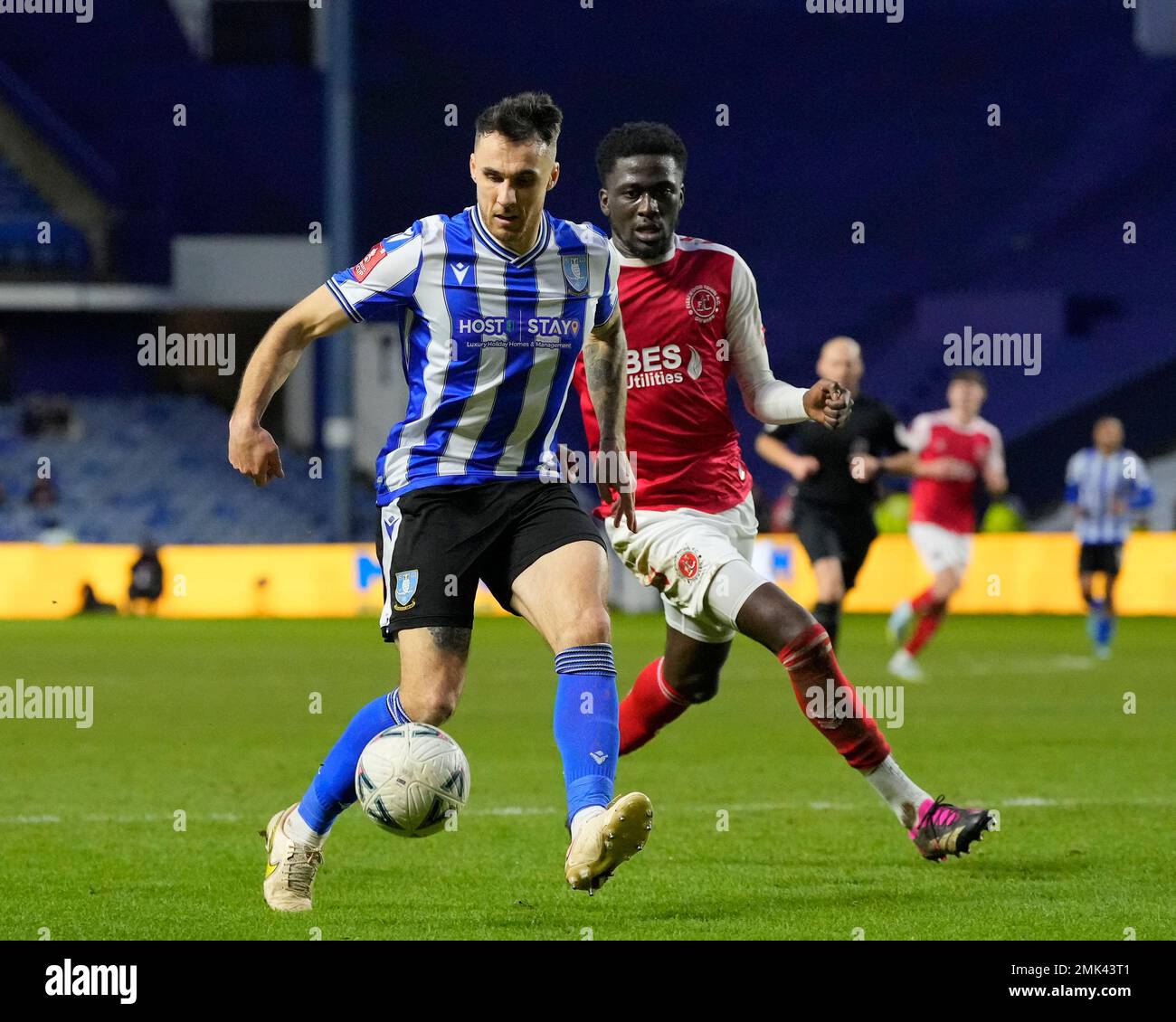 Lee Gregory #9 of Sheffield Wednesday shields the ball from Brendan ...