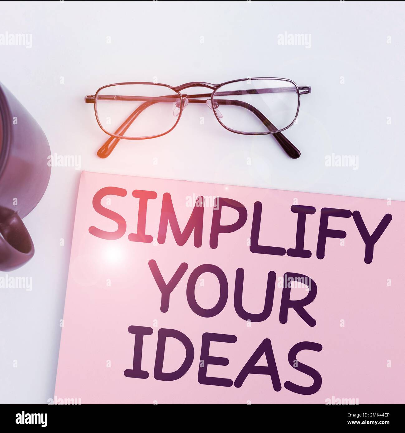 Hand writing sign Simplify Your Ideas. Word Written on make simple or ...