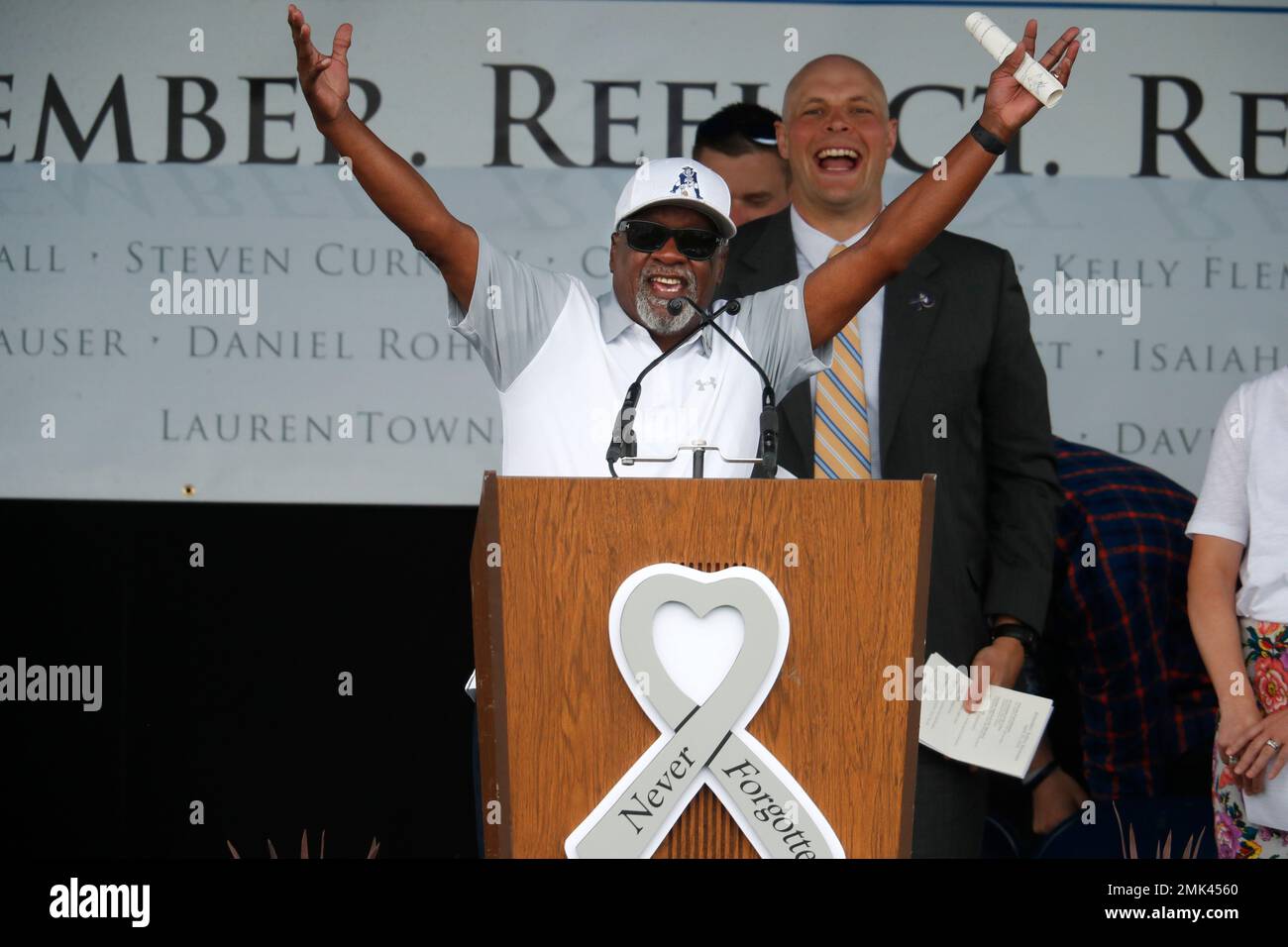 Ivory Moore, a teacher and coach at Columbine High School, leads ...