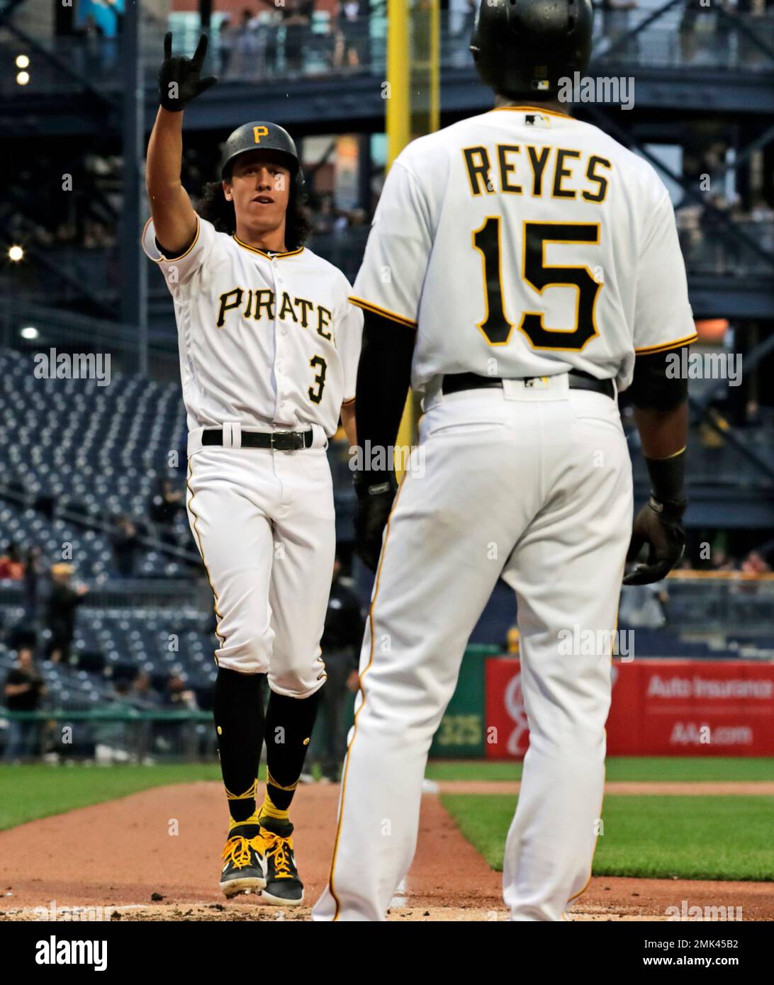 Pittsburgh Pirates' Cole Tucker (3) is greeted by Pablo Reyes as he ...