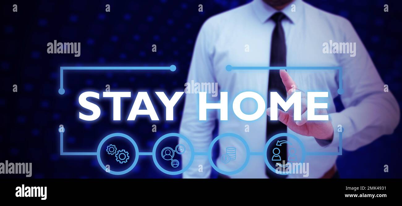 Sign displaying Stay Home. Word Written on not go out for an activity ...