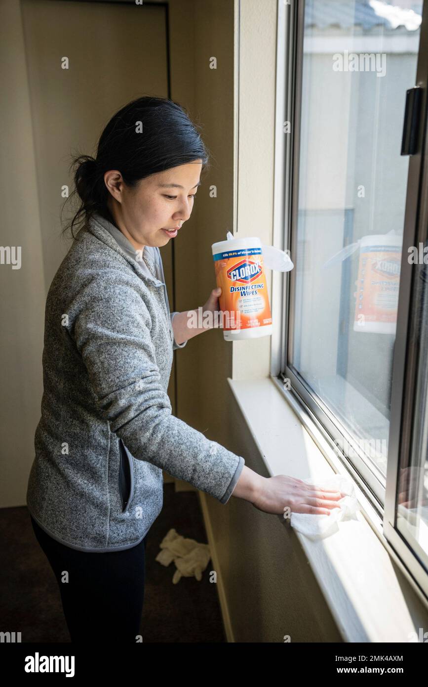 IMAGE DISTRIBUTED FOR CLOROX - A Clorox employee cleans the home of a ...