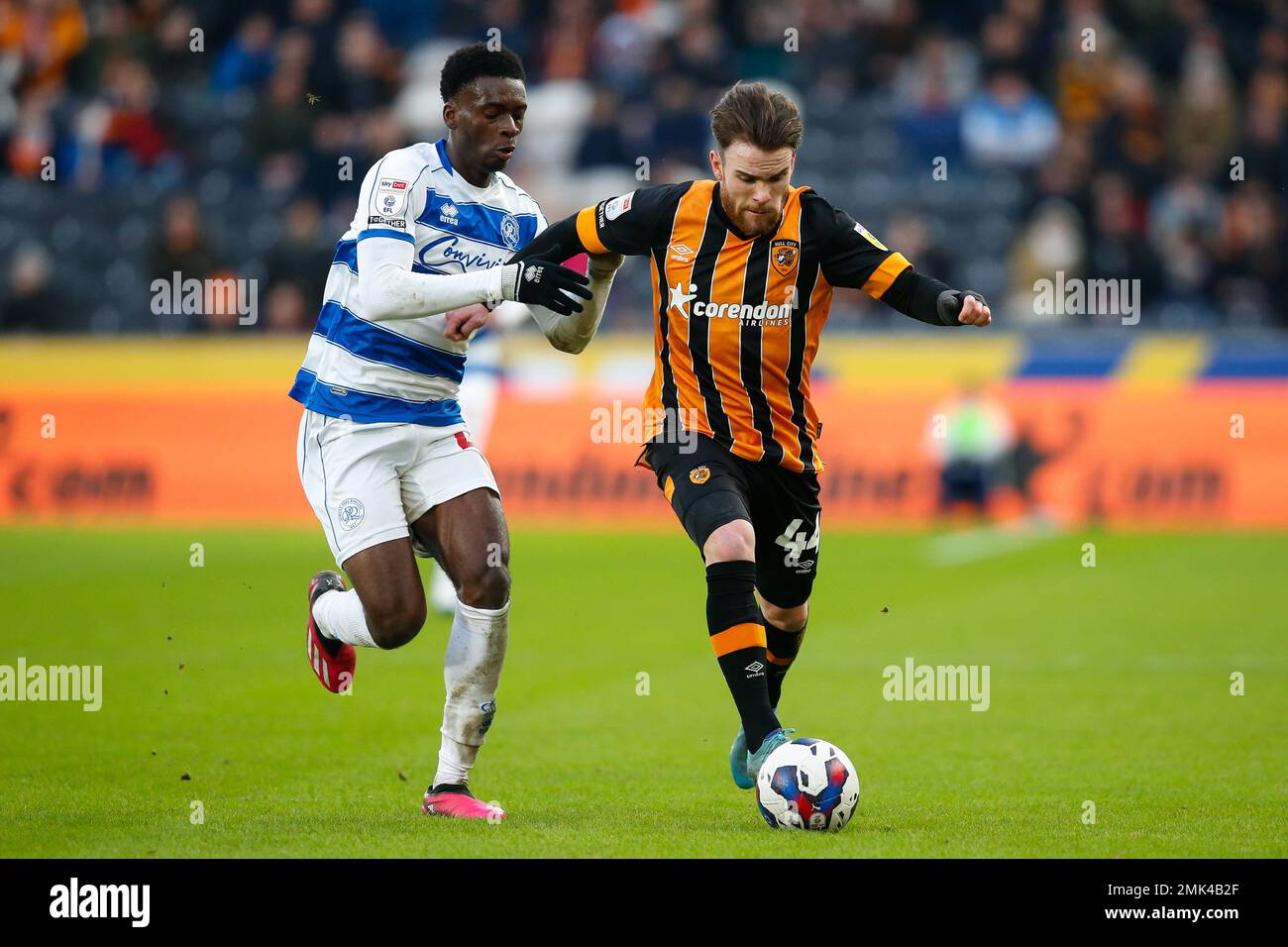 Aaron Connolly #44 of Hull City and Tim Iroegbunam #47 of QPR during the Sky Bet Championship ...