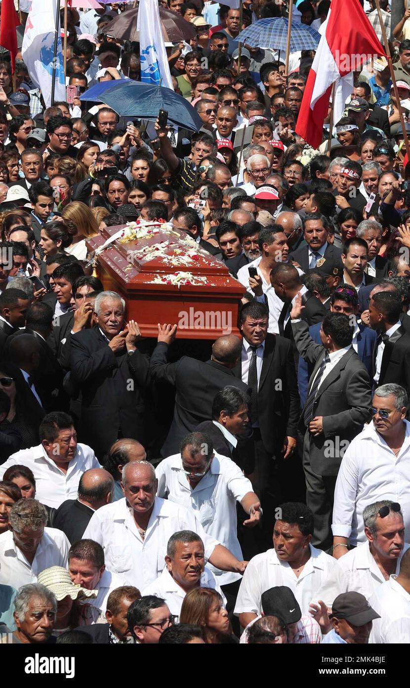 People carry the coffin of Peru's late President Alan Garcia during his ...