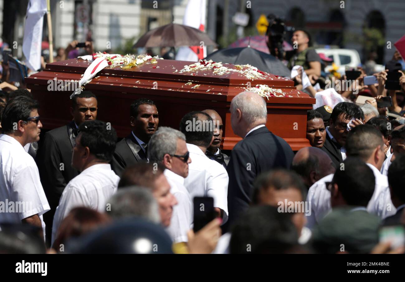 People carry the coffin of Peru's late President Alan Garcia during his ...