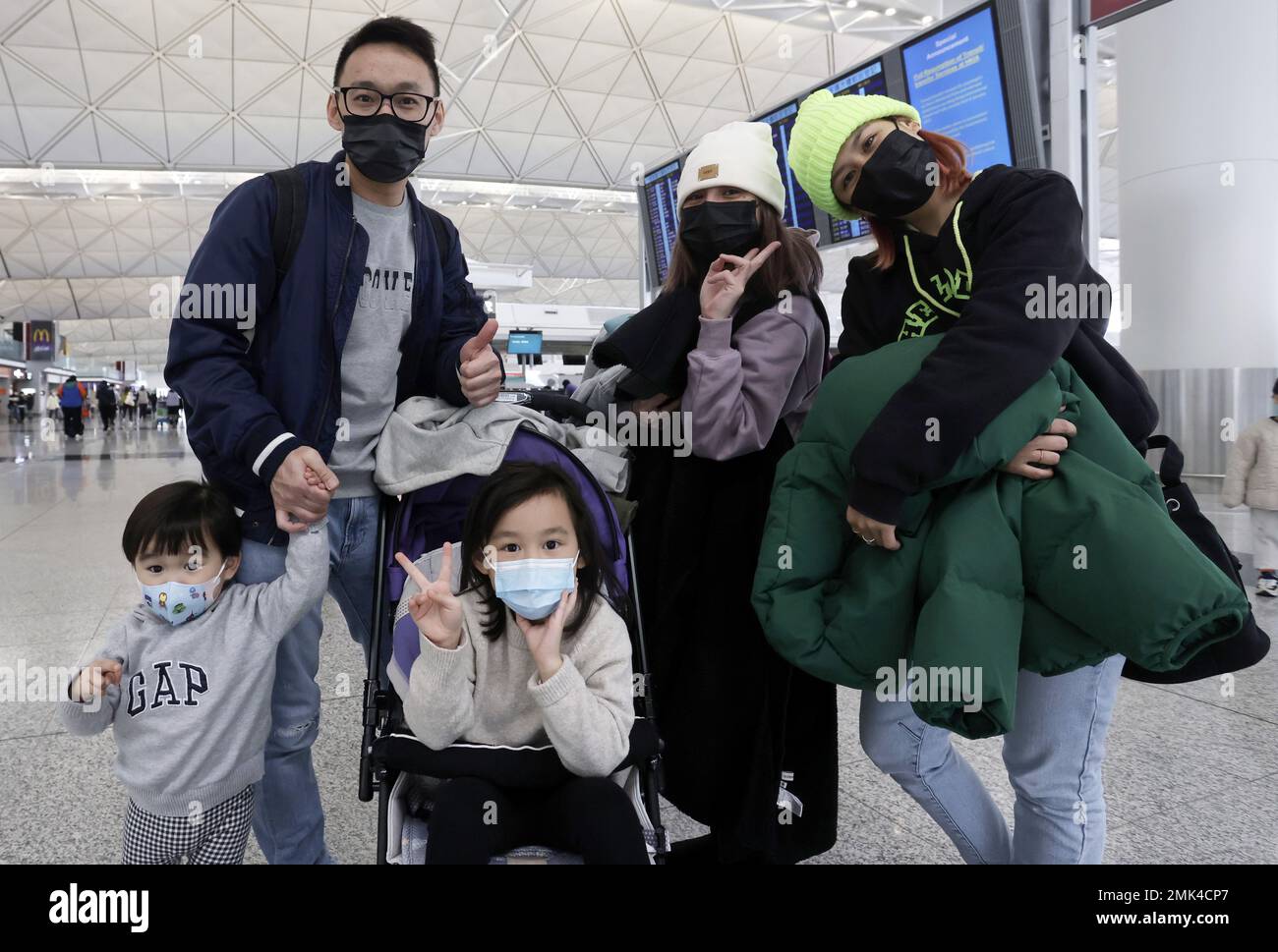 The Lee family from Hong Kong (full name not given) travelling to Seoul, at Hong Kong ...
