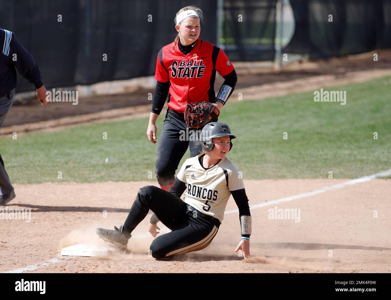 Western Michigan's Jenna Faultersack, right, is safe at third base as ...