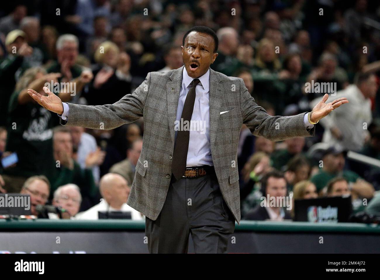 Detroit Pistons coach Dwane Casey yells to an official during the first ...