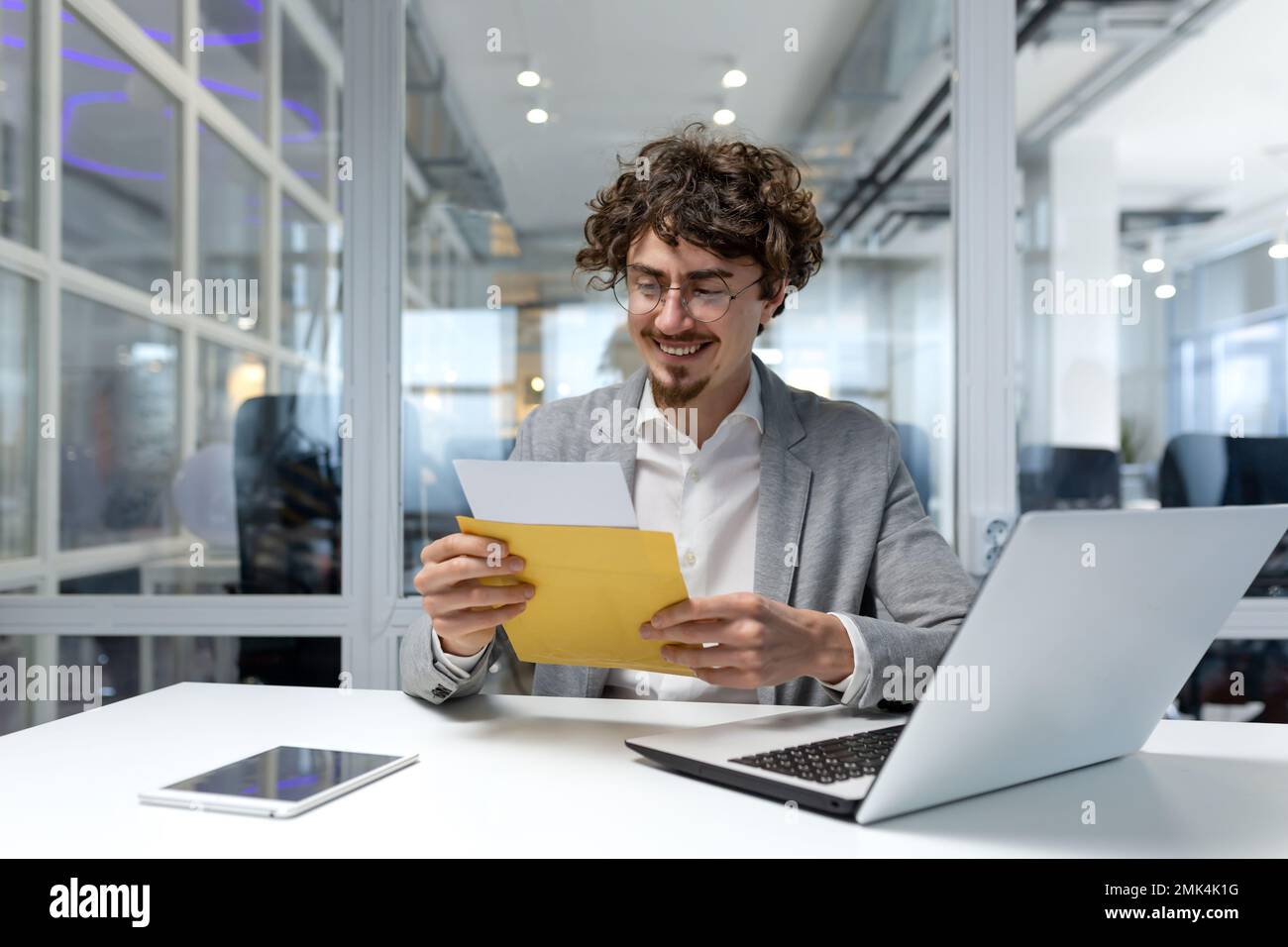 Successful businessman inside office at work, man received notification ...