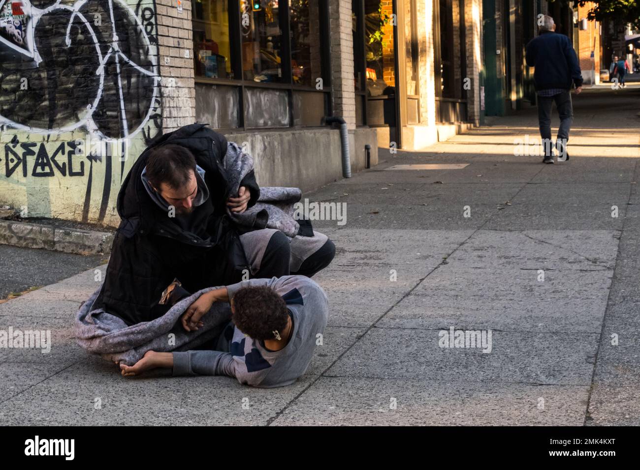 Helping someone get up hi-res stock photography and images - Alamy