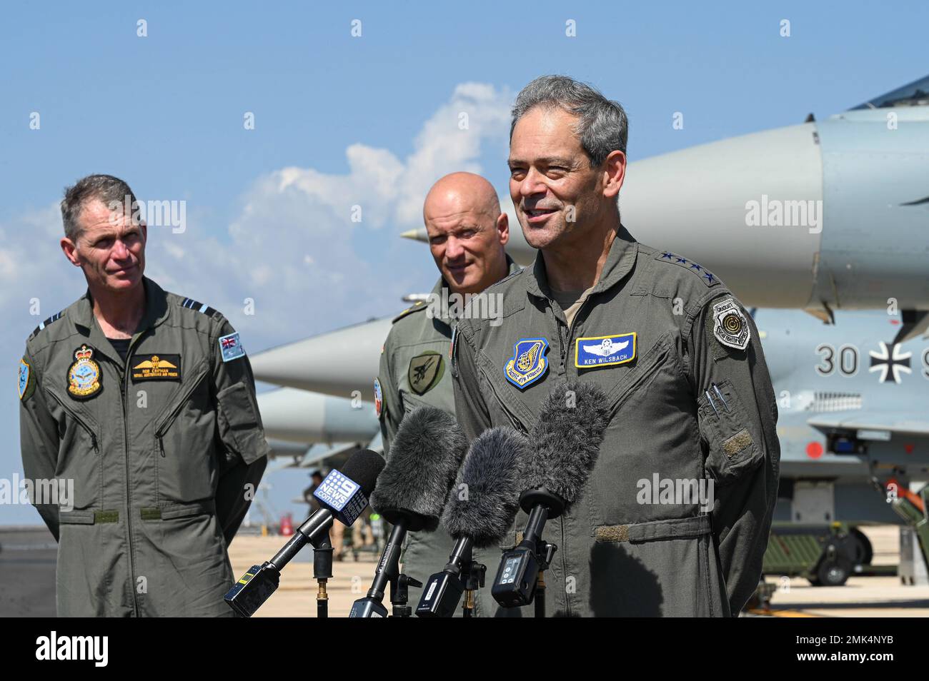U.S. Air Force Gen. Ken Wilsbach, right, Pacific Air Forces commander ...