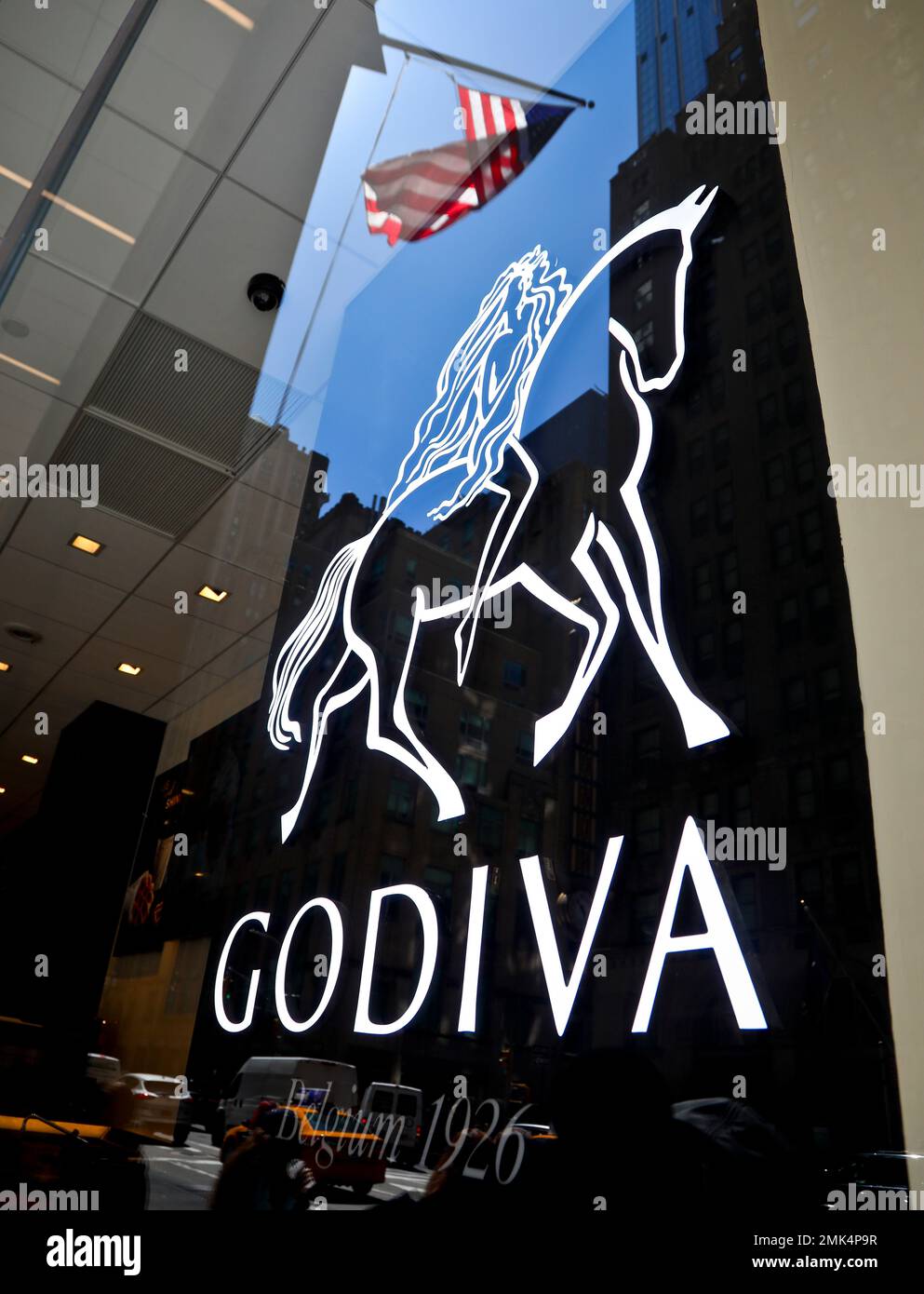 Godiva's logo stands out on the window of a new cafe in New York ...