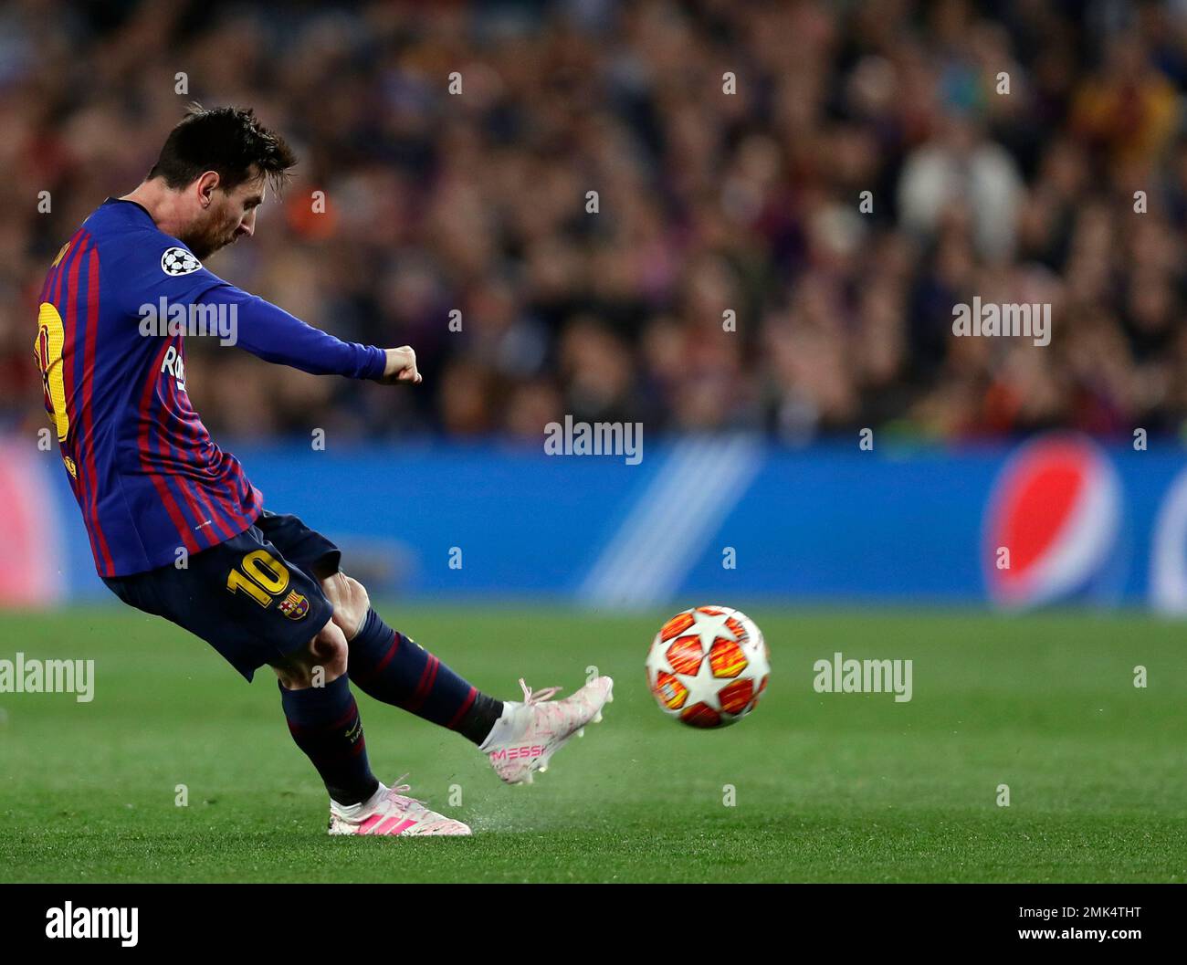 Barcelona forward Lionel Messi kicks the ball during the Champions ...
