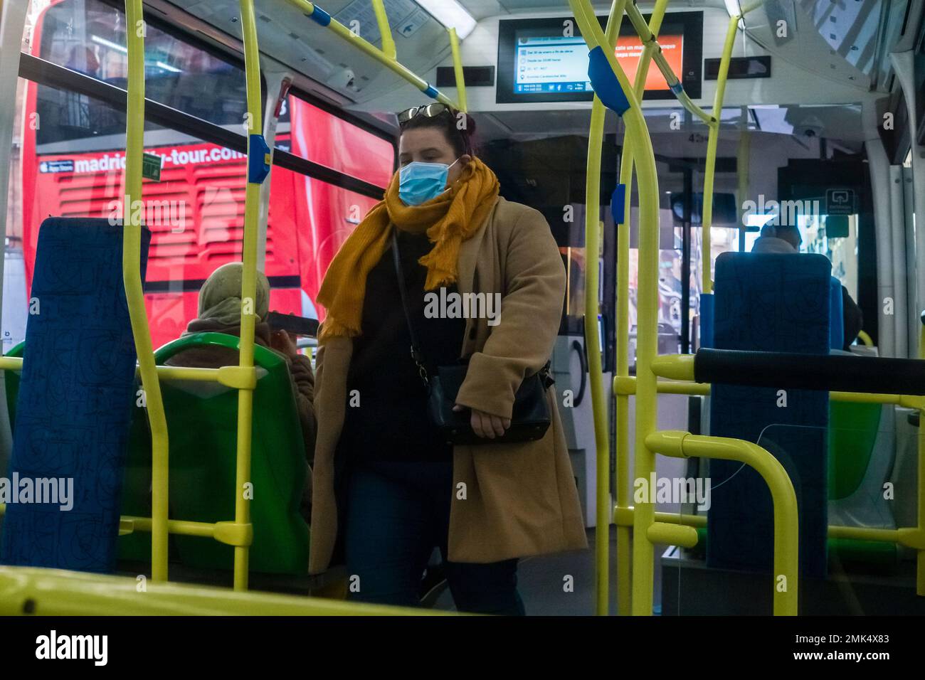 Woman Metro Madrid EMT bus system wearing masks against Covid. The ...