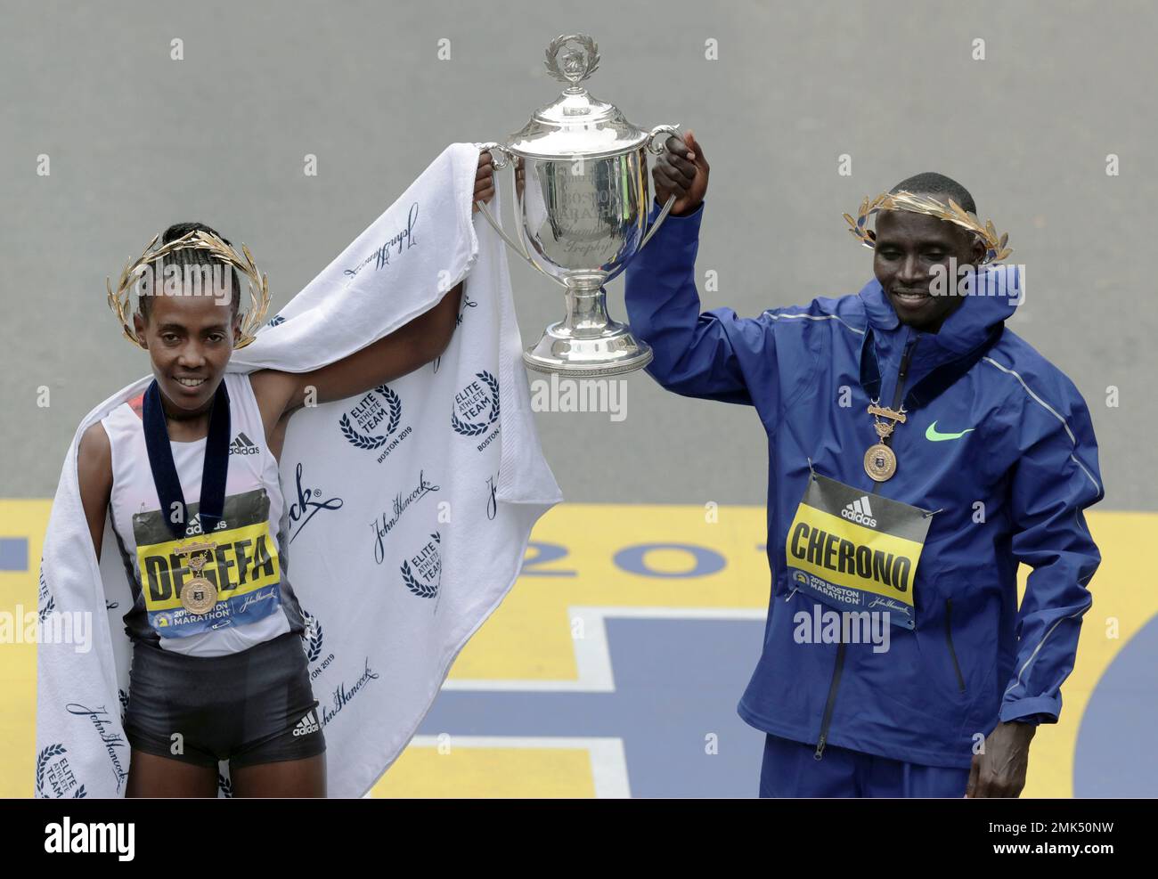 Worknesh Degefa, left, of Ethiopia, winner of the women's division, and ...