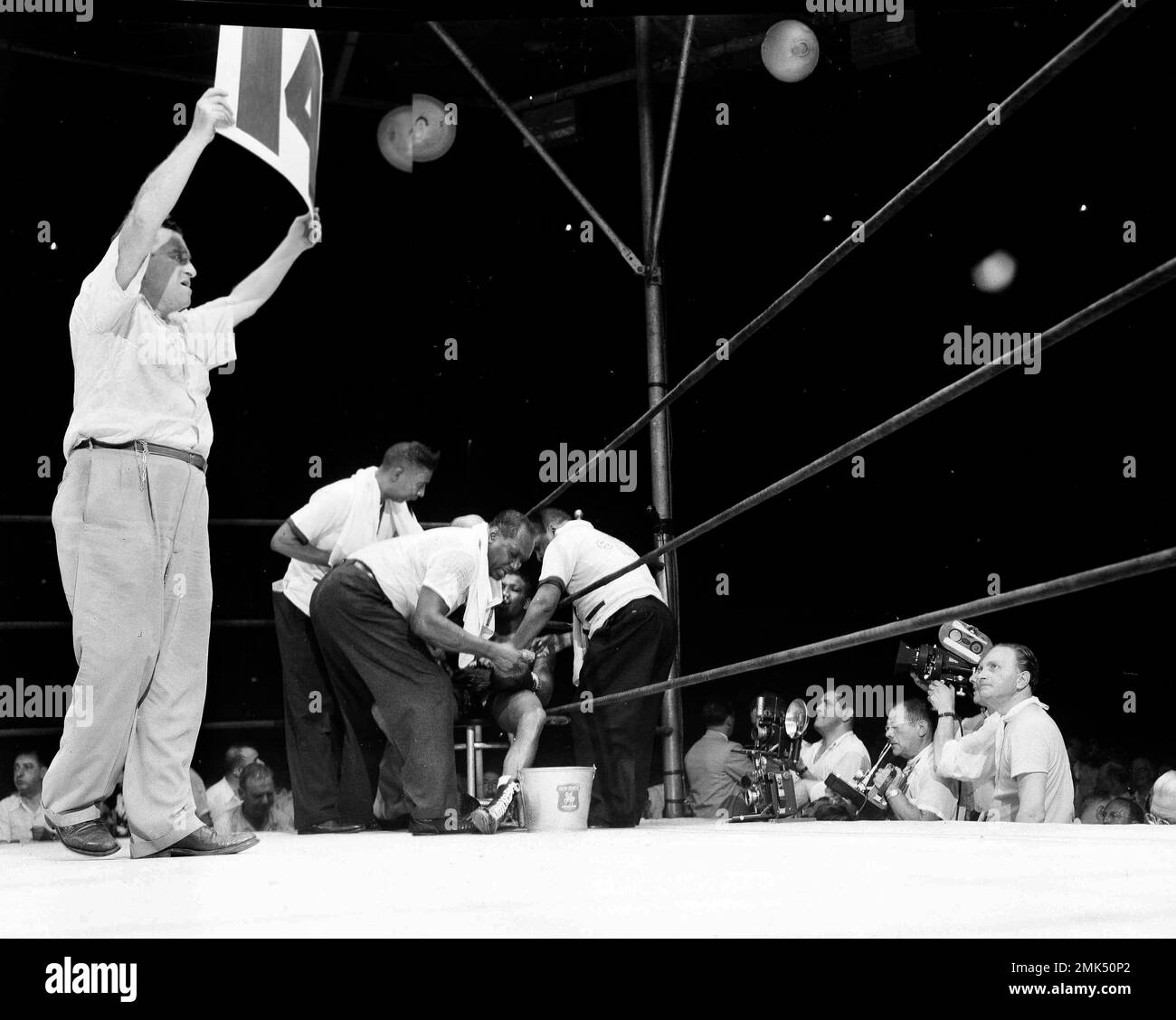 Handlers work over Sugar Ray Robinson in corner of ring in New York's ...