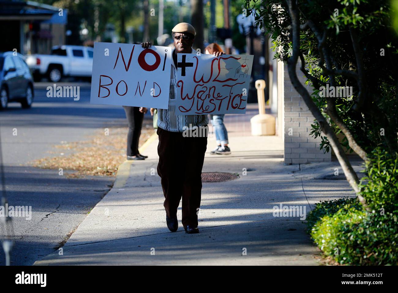 Wilfred Young, of the St. Landry Parish branch of the NAACP, carries ...