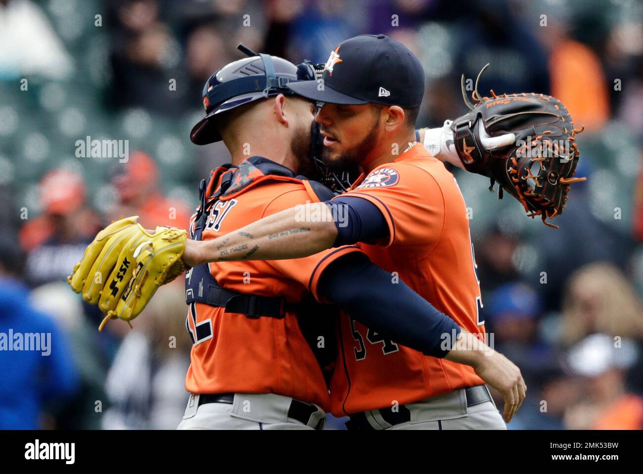 Houston Astros closing pitcher Roberto Osuna, right, embraces catcher ...